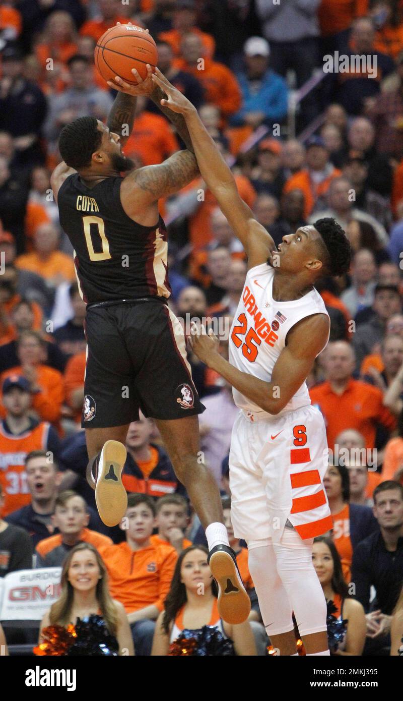 Florida State's Phil Cofer, left, shoots over Syracuse's Tyus Battle ...