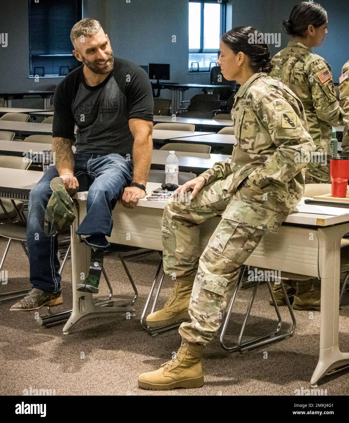 Earl Granville, a former U.S. Army sergeant, speaks with Sgt. Maj. Suzanne Polk, 75th Innovation ...