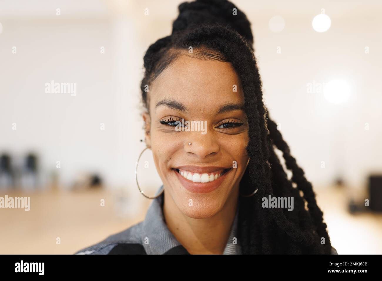 Image of happy african american female hip hop dancer posing to camera ...