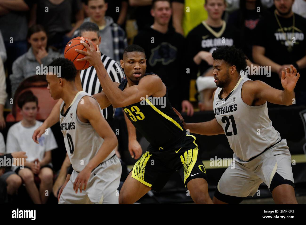 Oregon Ducks forward Francis Okoro (33) and Colorado Buffaloes forward ...