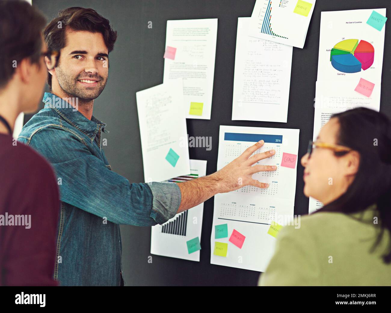 Conquering their dreams together. coworkers brainstorming in a modern ...