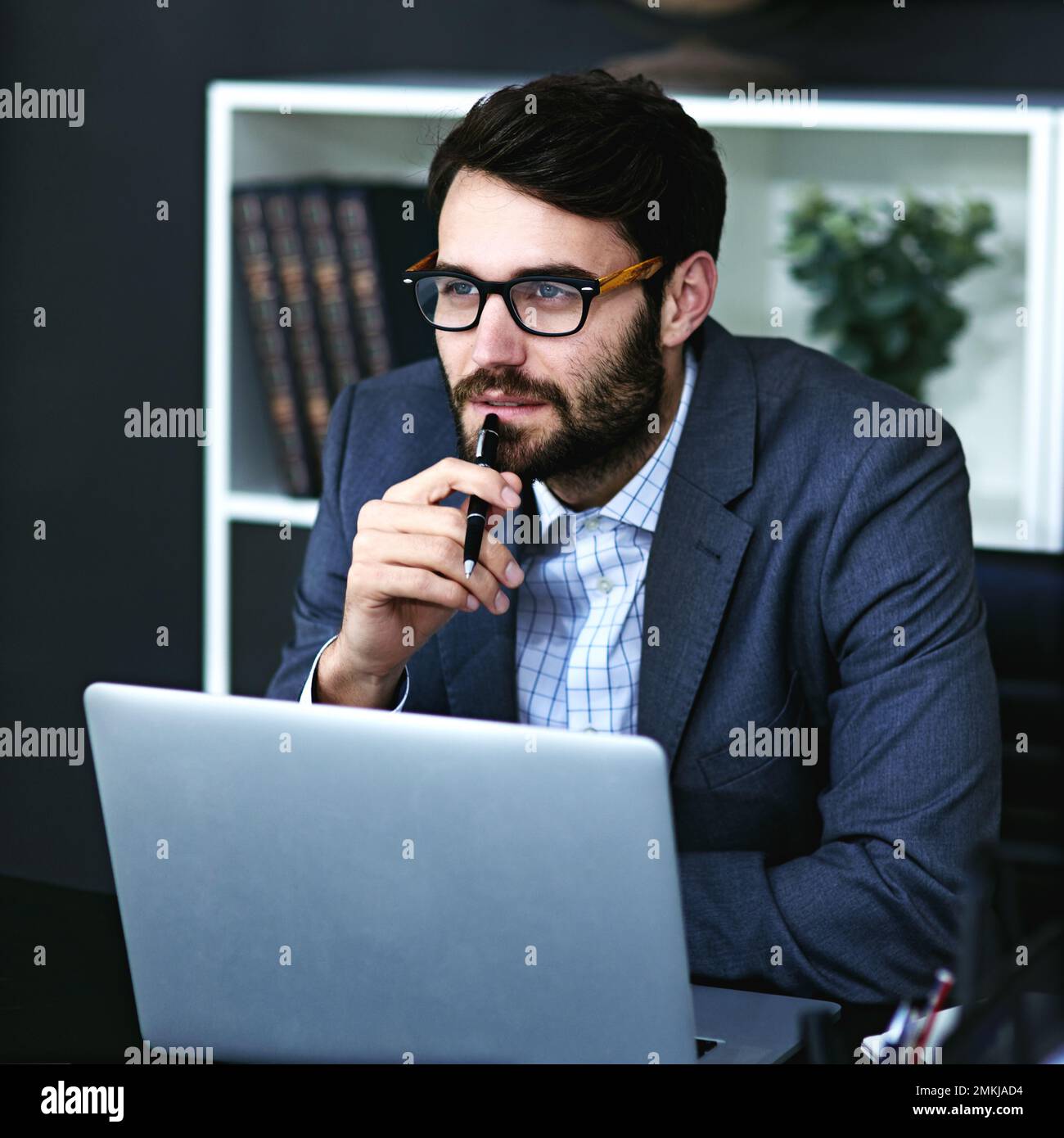 Businessman thinking in front laptop hi-res stock photography and ...