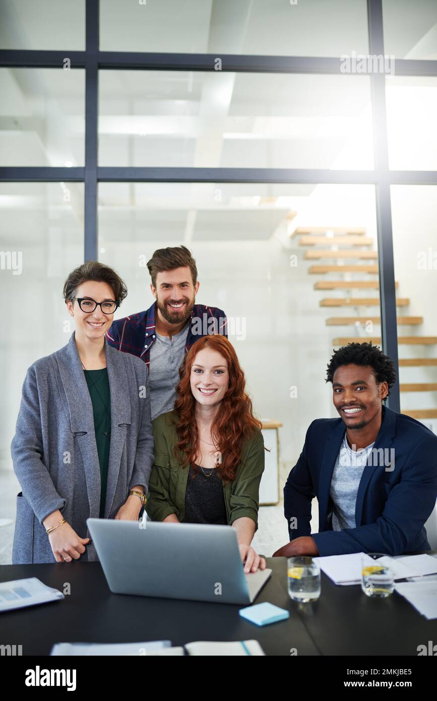 Working efficiently and effectively together. Portrait of a group of ...