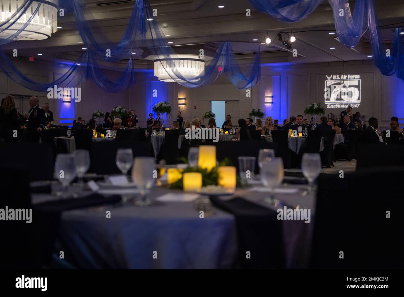 U.S. Airmen and their guests mingle amongst each other before formal ...