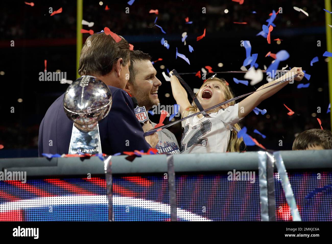 New England Patriots' Tom Brady holds his daughter Vivian, after the ...
