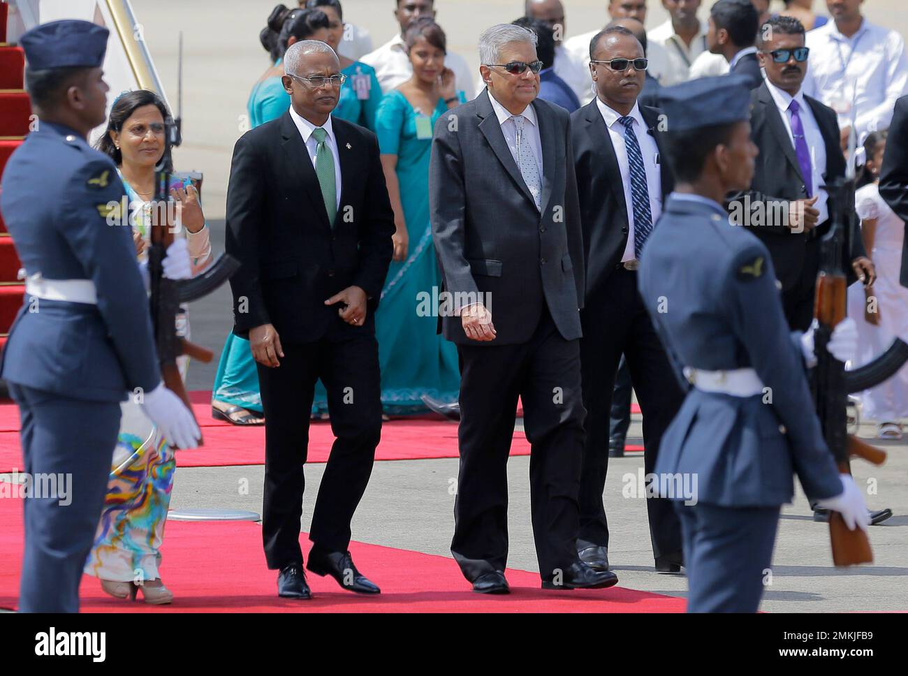 Maldives' President Ibrahim Mohamed Solih, center, walks with his wife ...