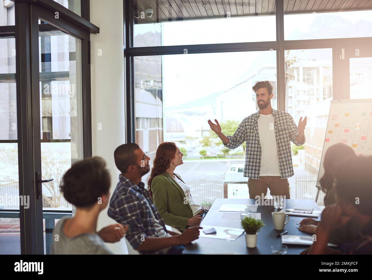 Making some positive progress as a team. a businessman giving a ...