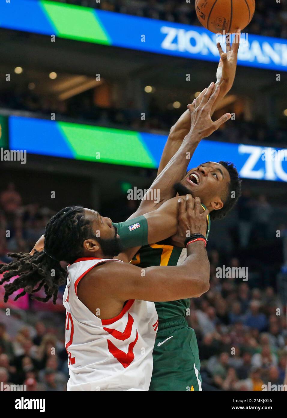 Houston Rockets center Nene Hilario, left, fouls Utah Jazz guard ...