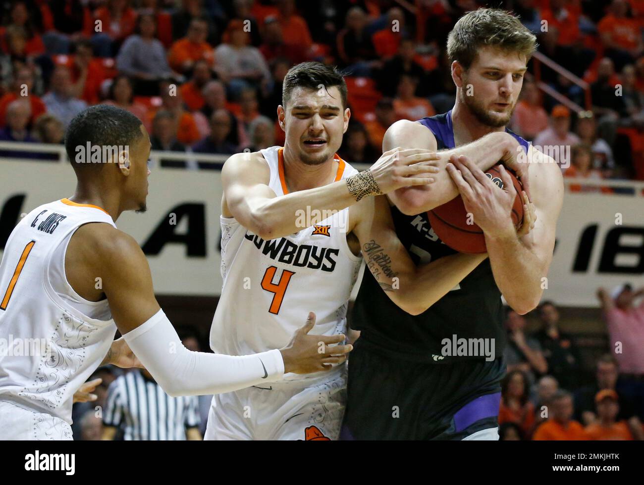 Kansas State forward Dean Wade, right, grabs a rebound in front of ...