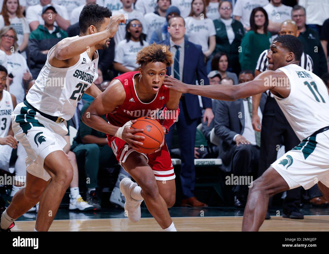 Indiana's Romeo Langford, center, drives between Michigan State's Kenny ...