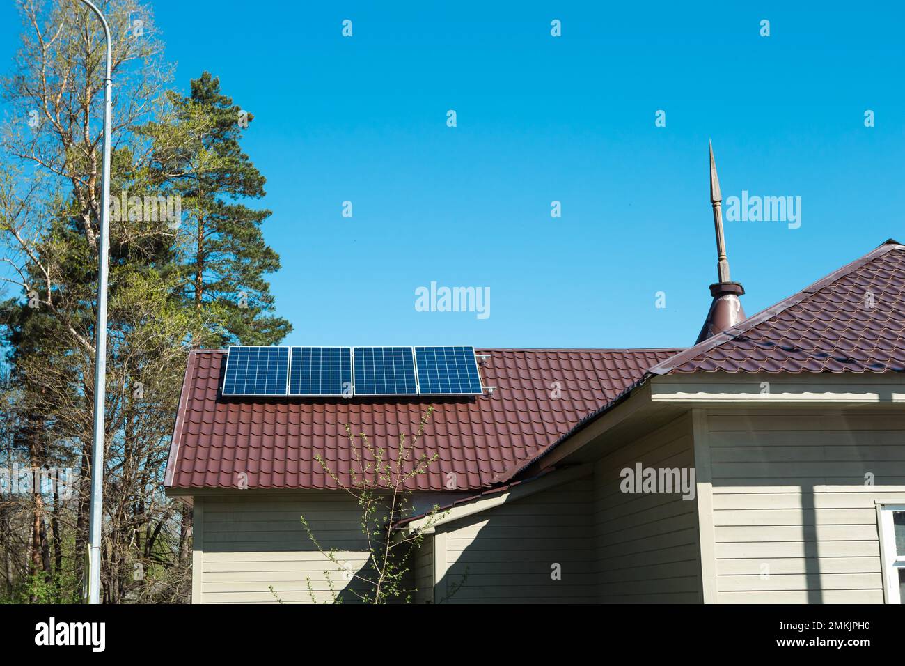 Solar panels on the roof of a private one-story house in the ...