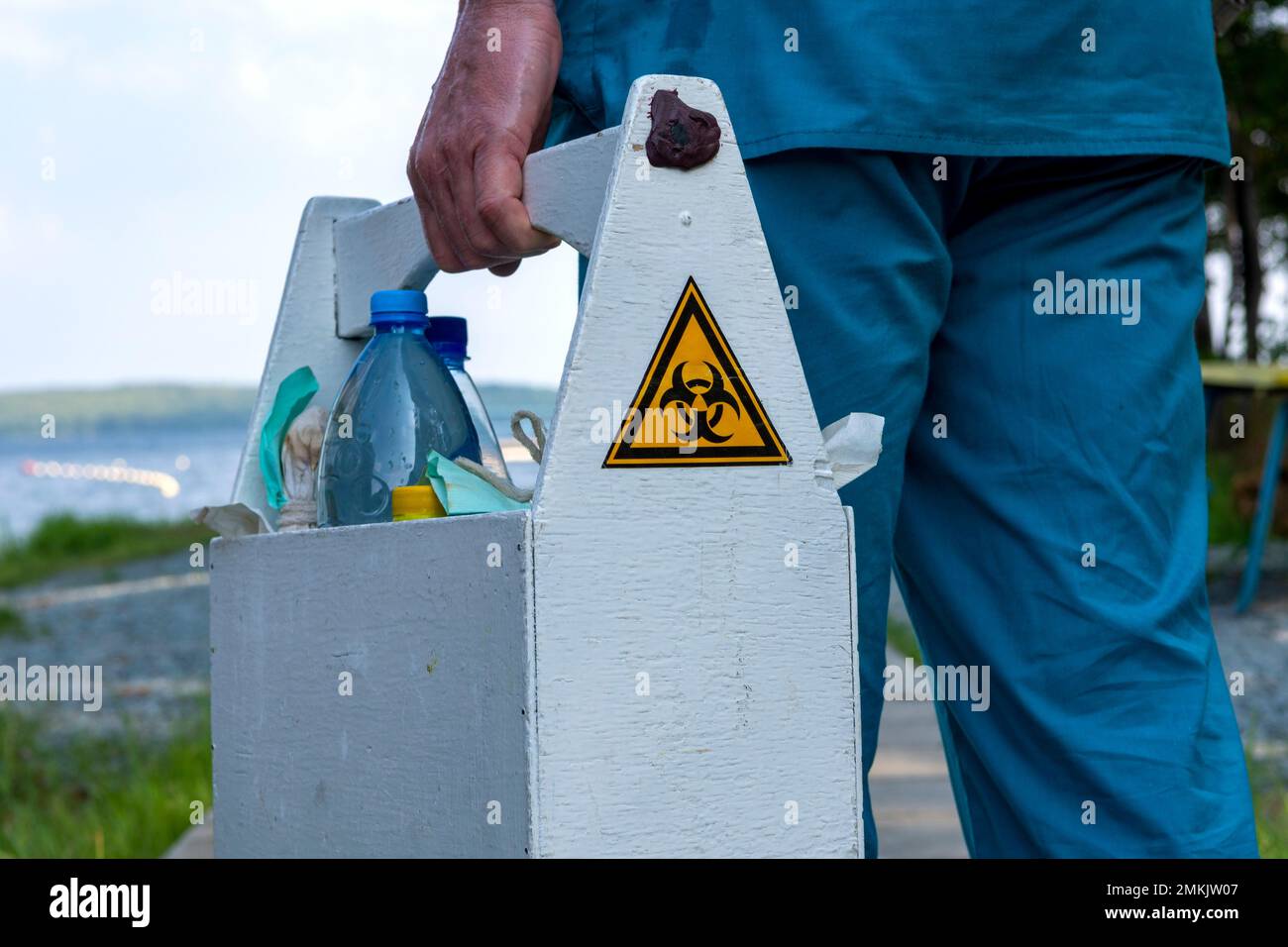 Biohazard sign on the box with samples of water from the lake in the ...