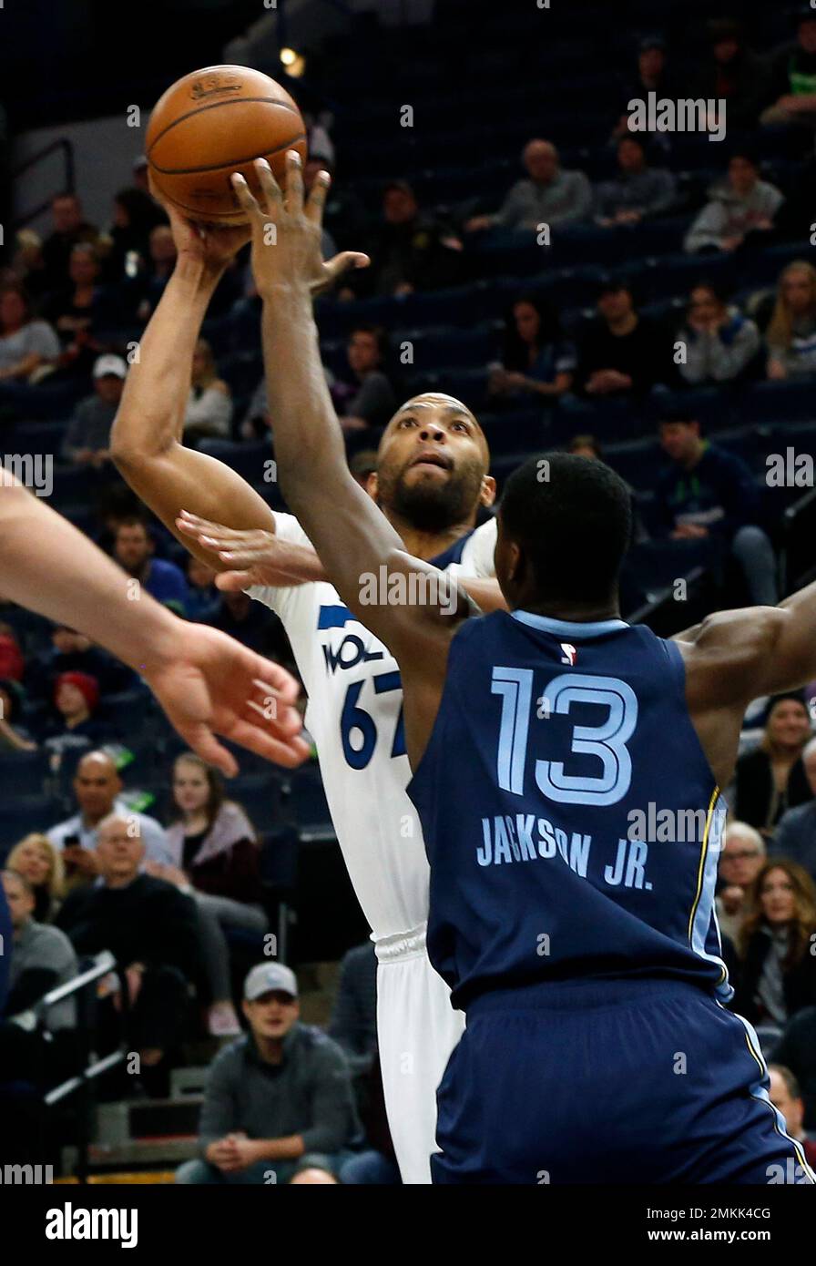 Minnesota Timberwolves' Taj Gibson, left, looks to shoot as Memphis ...