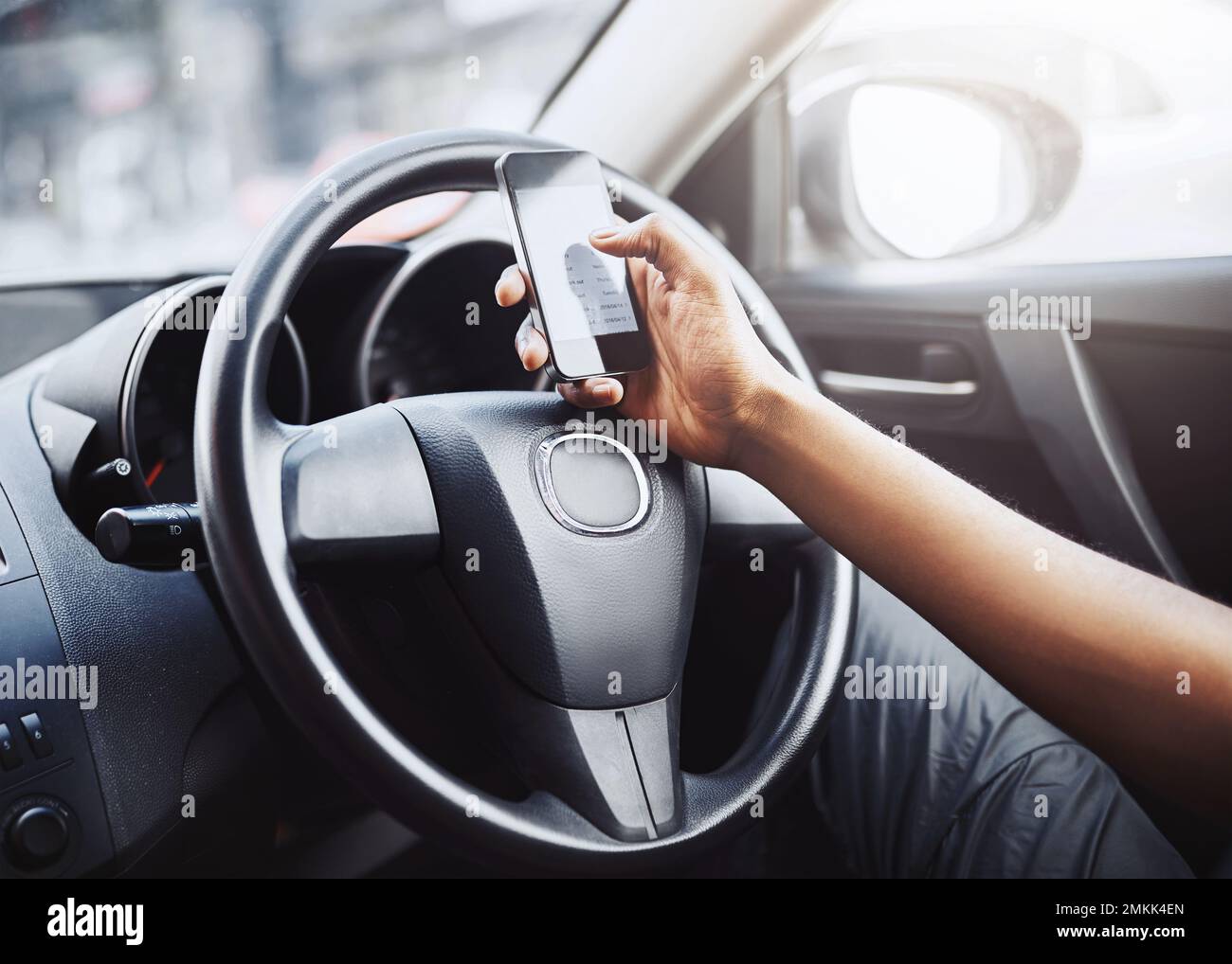 Your phone is a distraction on the road. an unrecognizable man using ...