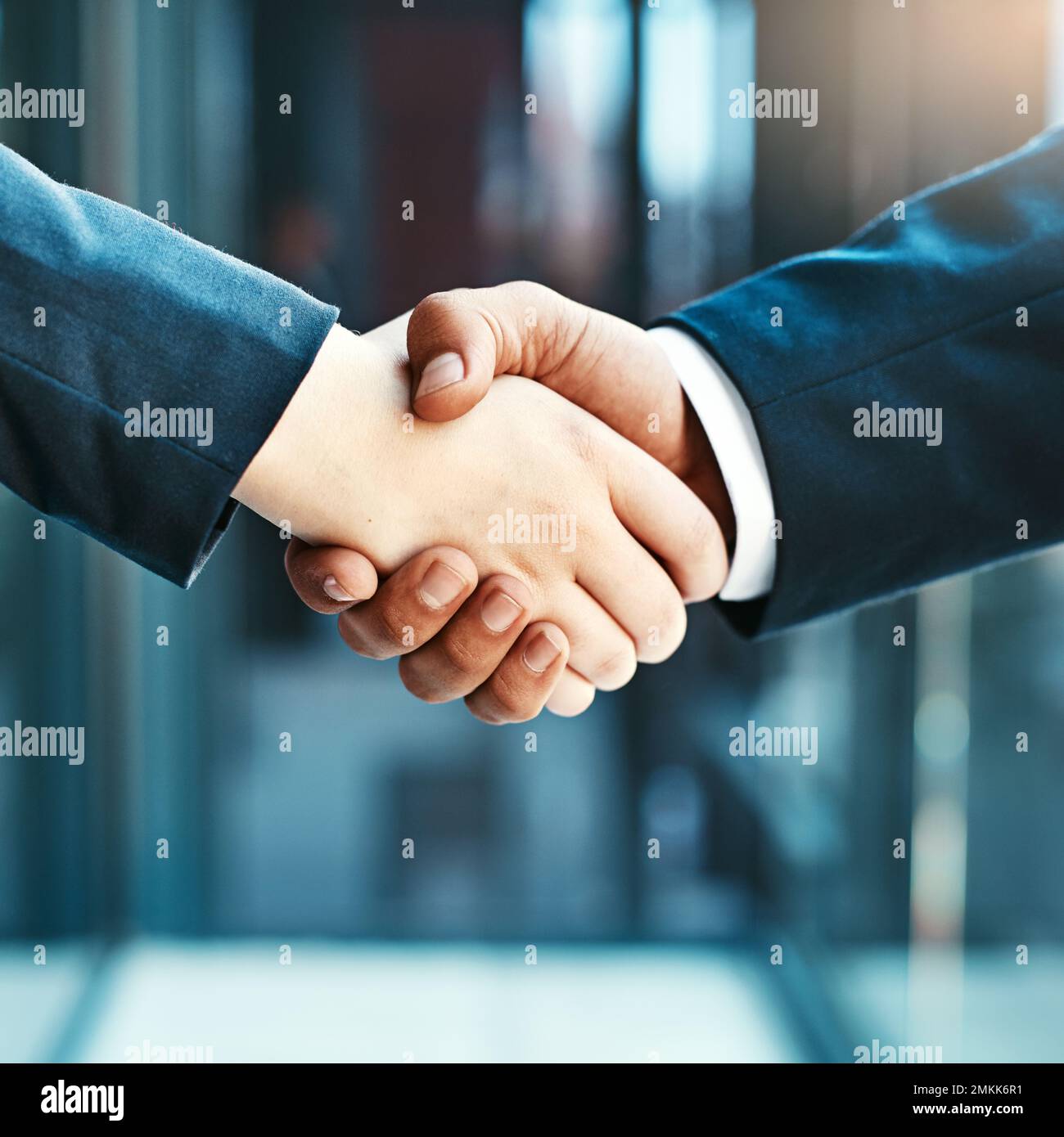 Our partnership comes with so many benefits. two businesspeople shaking hands Stock Photo - Alamy