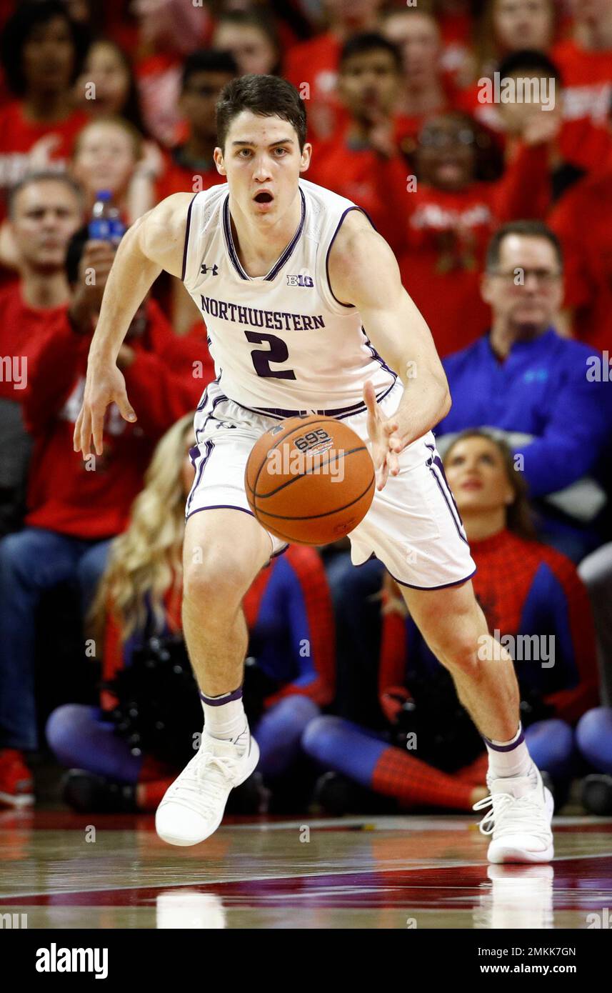 Northwestern guard Ryan Greer drives the ball in the first half of an ...