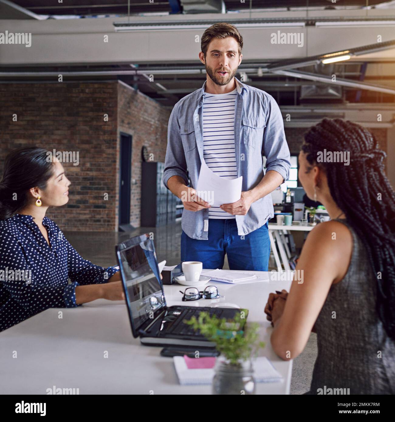 Coming to them for advice. a creative businessperson working in the ...