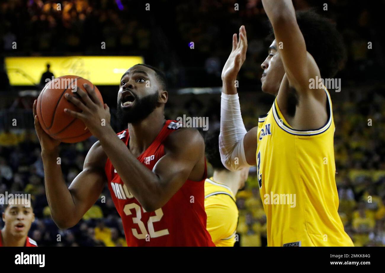 Ohio State guard Keyshawn Woods (32) makes a layup as Michigan guard ...