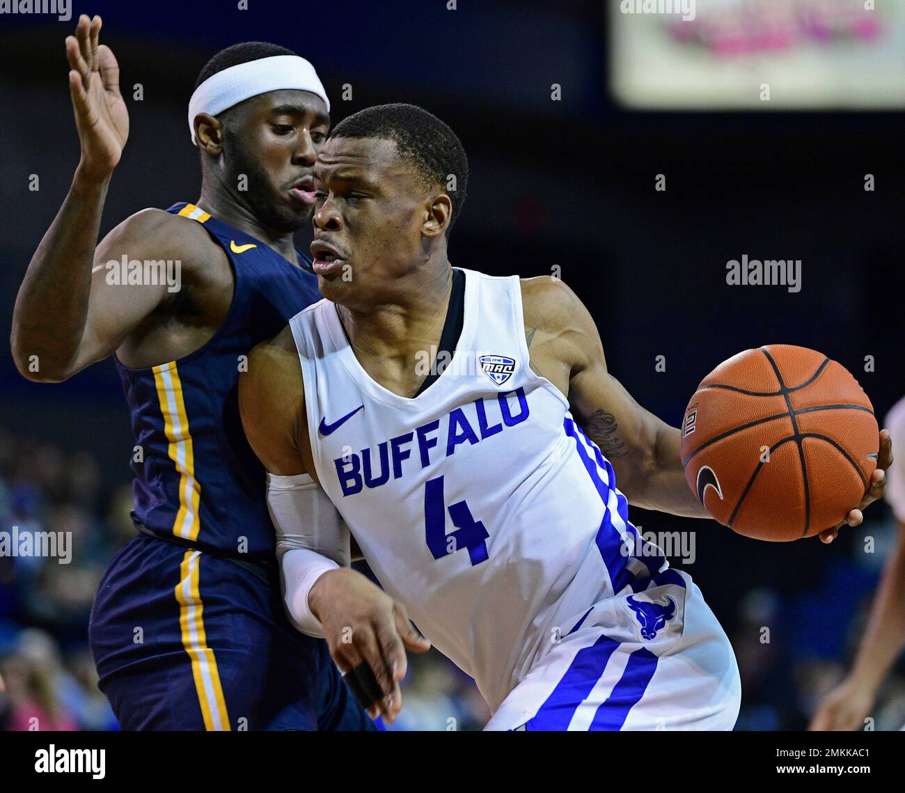 Buffalo guard Davonta Jordan drives on Toledo guard Marreon Jackson ...