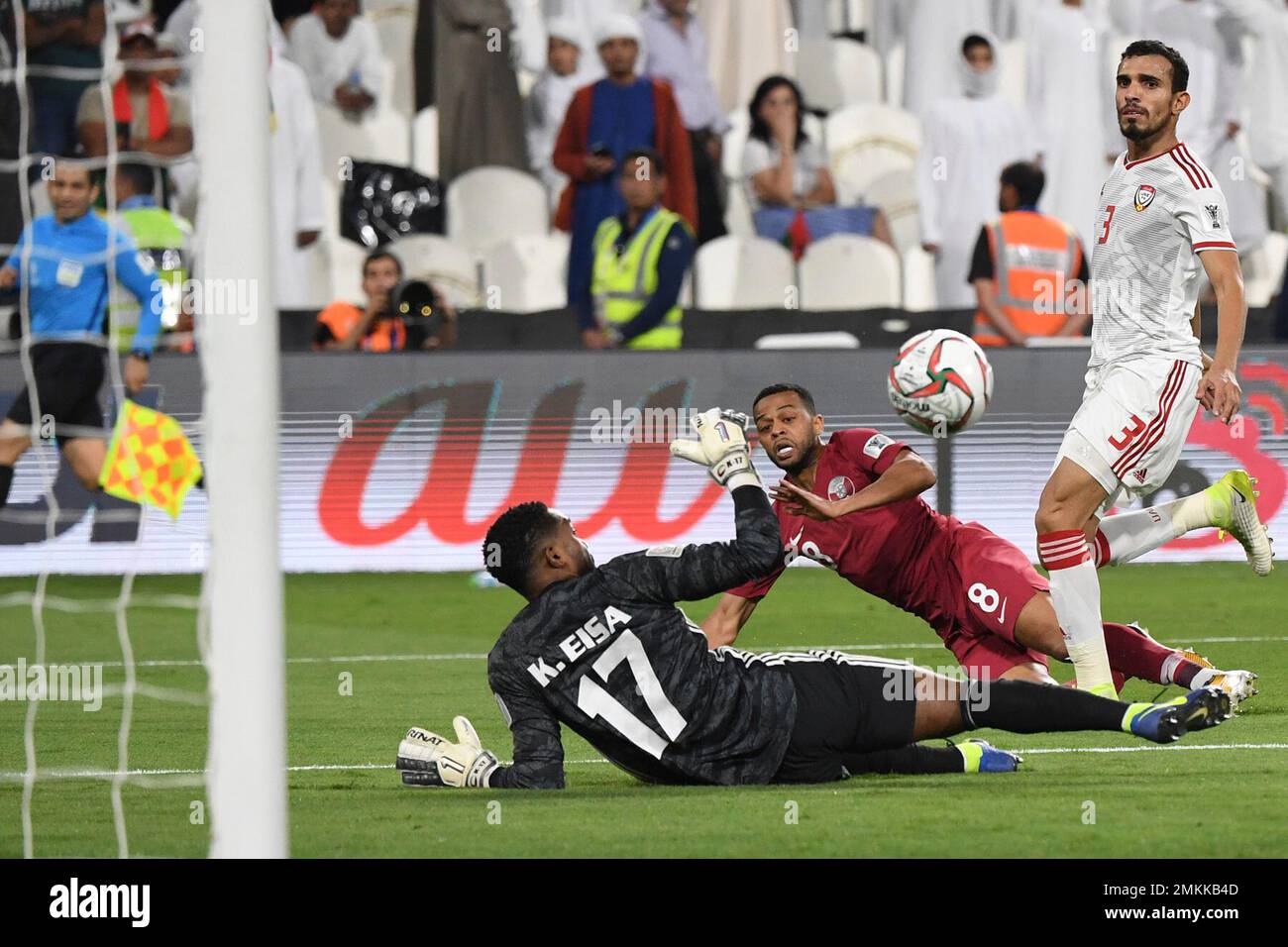 Qatar's defender Hamid Ismail, centre, scores his side's fourth goal ...