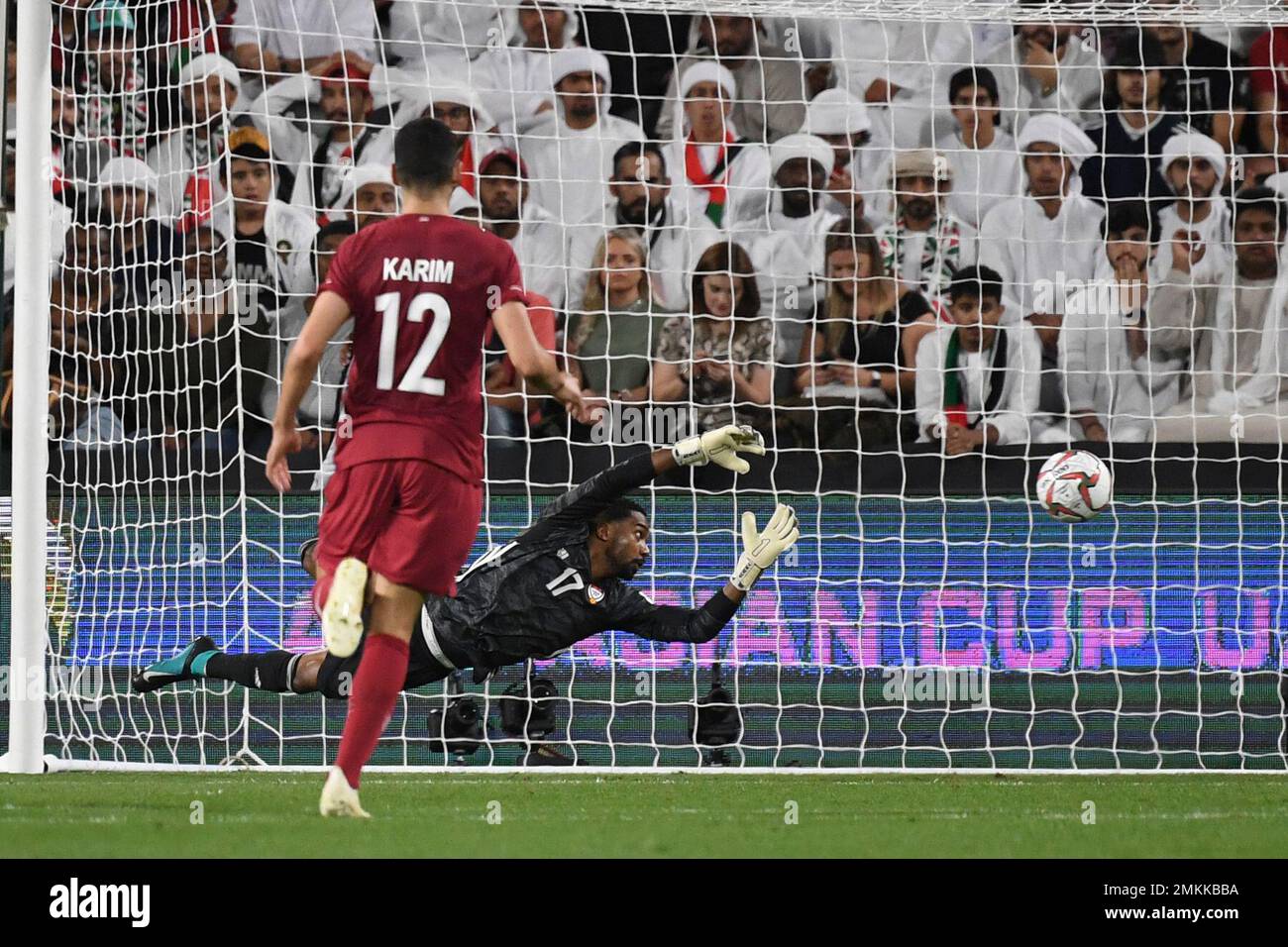 United Arab Emirates' goalkeeper Khalid Eisa fails to stop the kick by ...