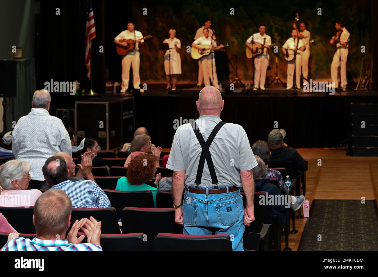 Veterans stand as their service song is performed by U.S. Navy Band ...