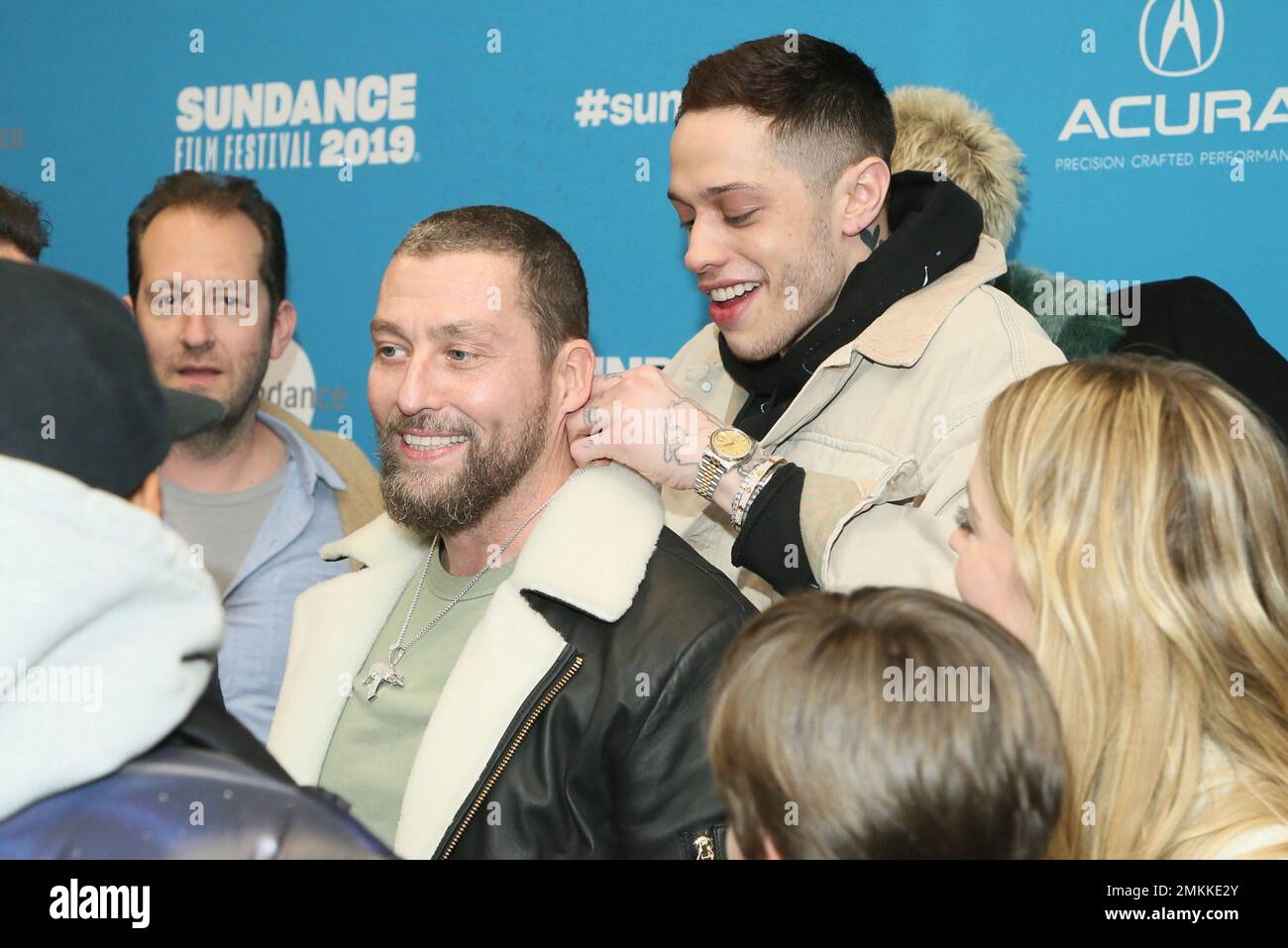 Actor Joseph Vincent Gay gets a machine gun necklace from Pete Davidson ...
