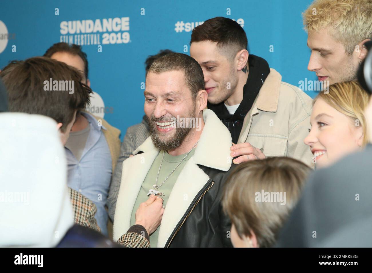 Actor Joseph Vincent Gay gets a machine gun necklace from Pete Davidson ...