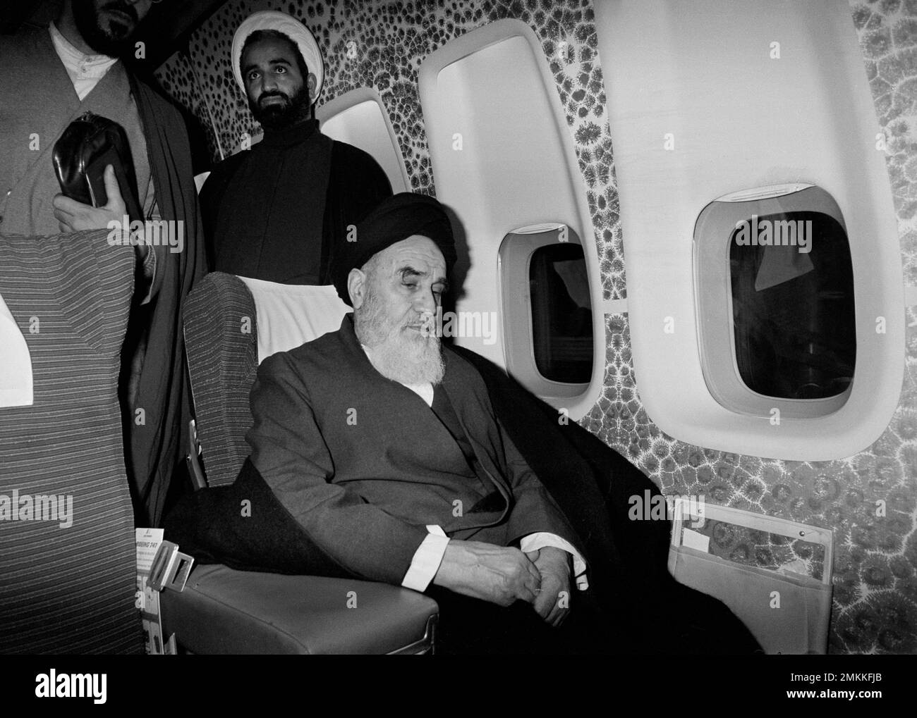 The Ayatollah Ruhollah Khomeini sits inside the chartered airplane in ...