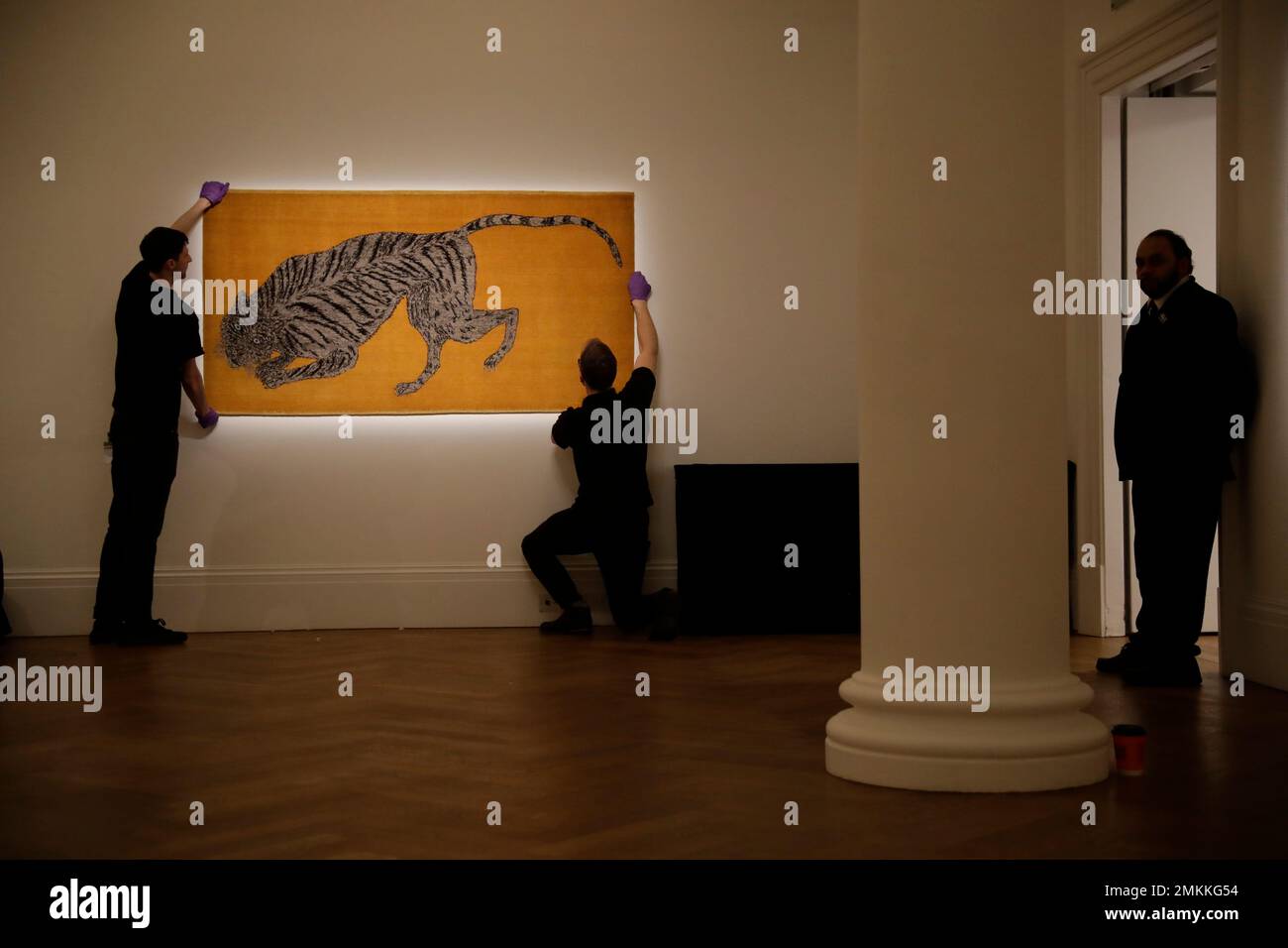 Sotheby's staff pose for photographers with West German-born American ...