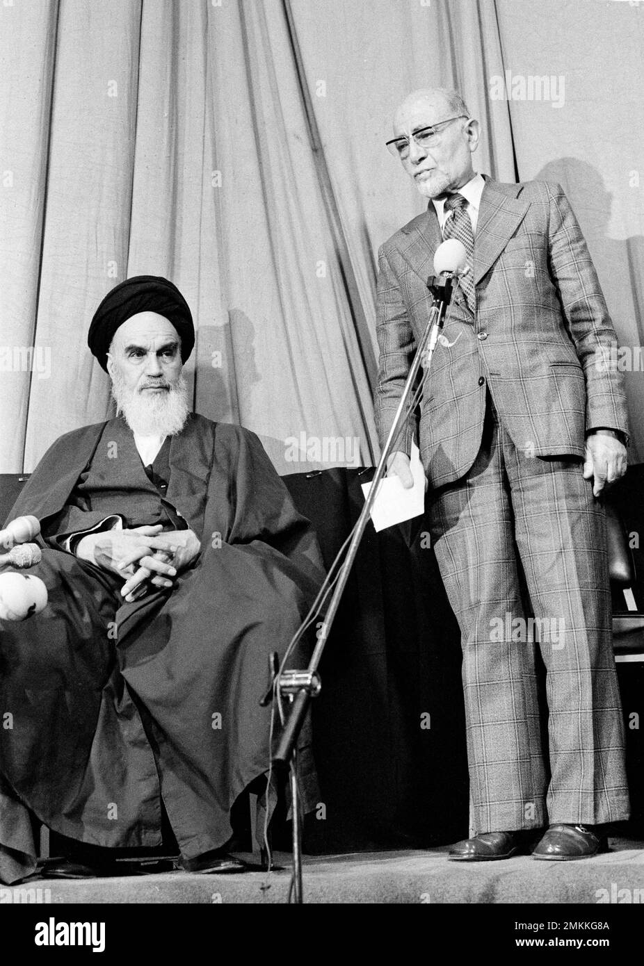 Ayatollah Ruhollah Khomeini, seated, is pictured with newly-named prime ...