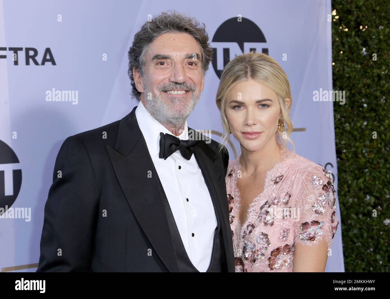 Chuck Lorre, left, and Arielle Mandelson arrive at the 25th annual ...