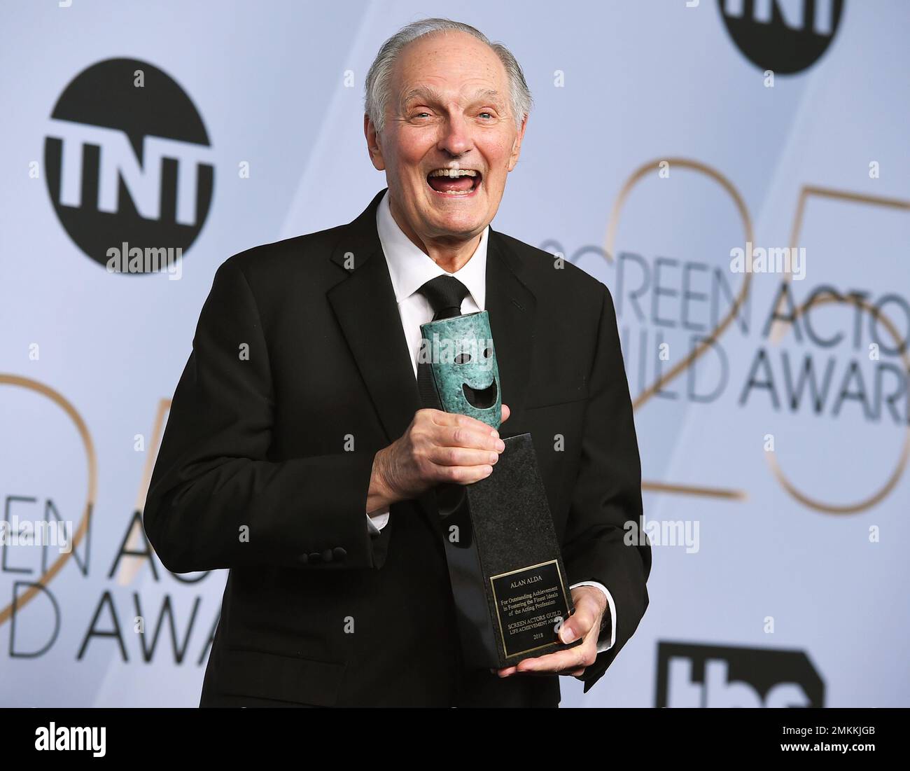 Alan Alda poses with the Life Achievement Award in the press room at ...
