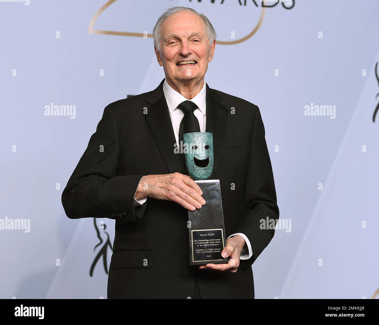 Alan Alda poses with the Life Achievement award in the press room at ...