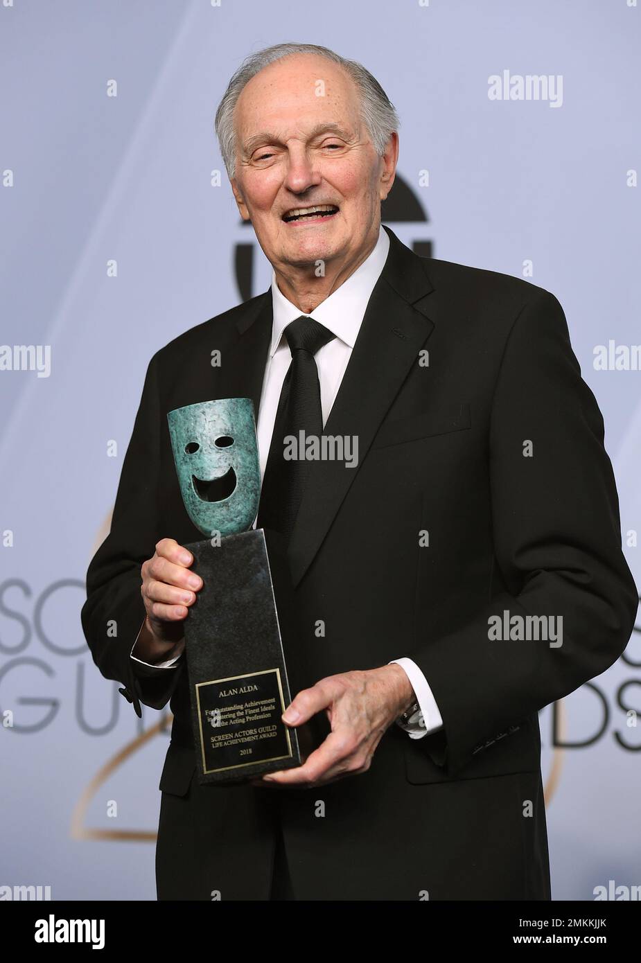 Alan Alda poses with the Life Achievement award in the press room at ...