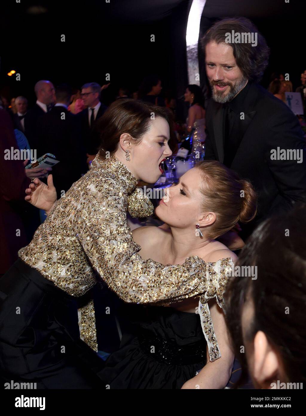 Emma Stone, left, and Amy Adams embrace at the 25th annual Screen ...