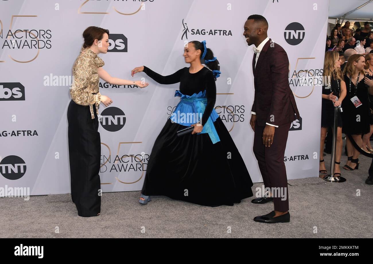 Emma Stone, from left, Amatus Sami-Karim and Mahershala Ali arrive at ...