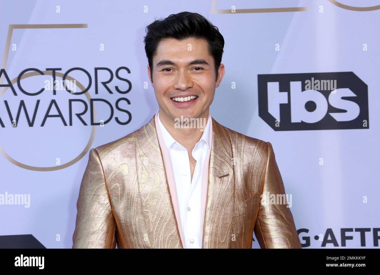 Henry Golding arrives at the 25th annual Screen Actors Guild Awards at ...