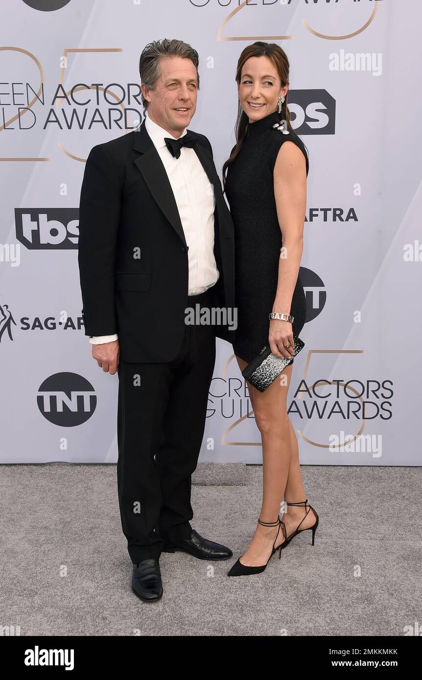 Hugh Grant, left, and Anna Elisabet Eberstein arrive at the 25th annual ...