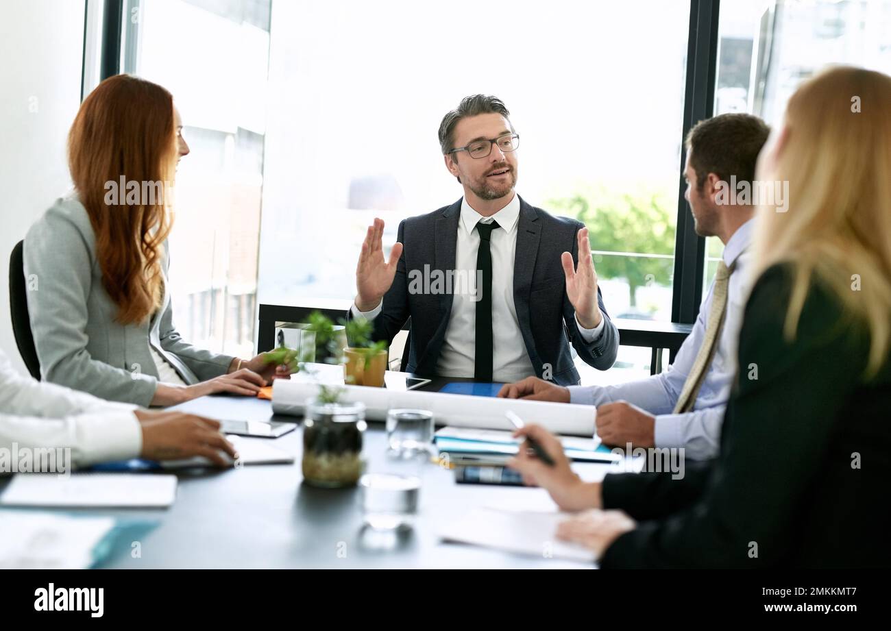 Defining clear objectives for their meeting. a team of executives ...