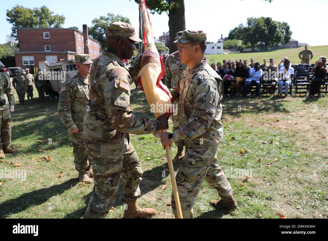 Col. Thomas J. Kim, 77th Sustainment Brigade Commander, presents the ...