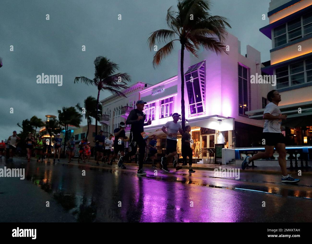 Runners go along Ocean Drive during the annual Miami Marathon, Sunday ...