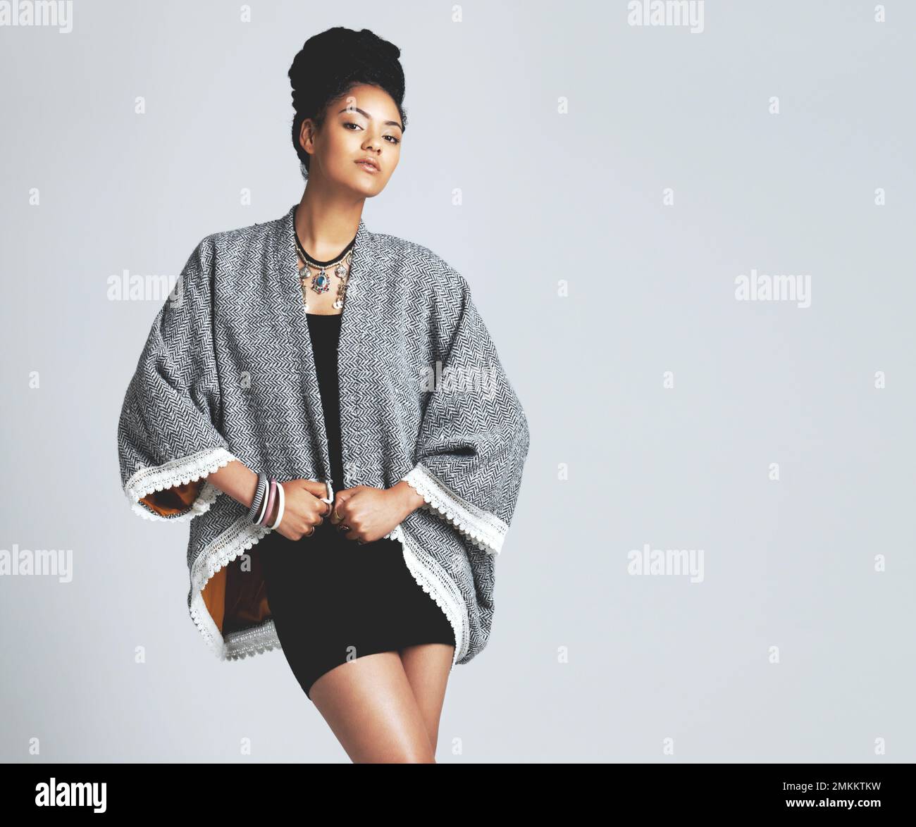 Stand up and take notice style. Studio shot of a fashionable young ...