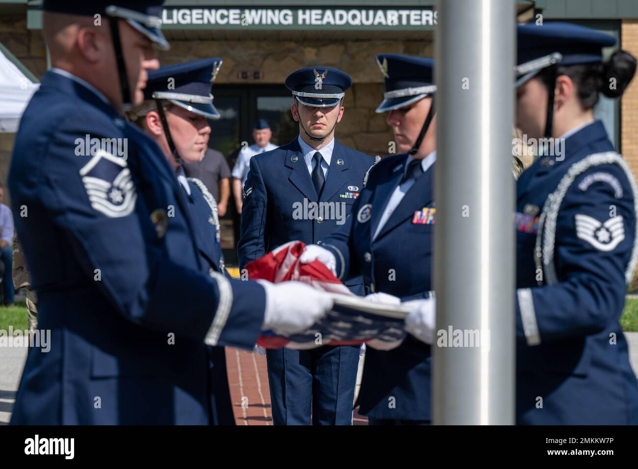 Members of the 181st Intelligence Wing Base Honor Guard fold the flag ...