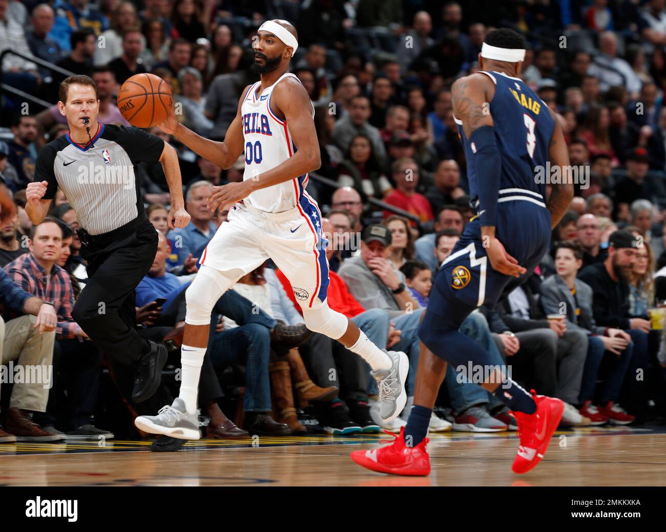 Philadelphia 76ers guard Corey Brewer, back, drives down the court with ...