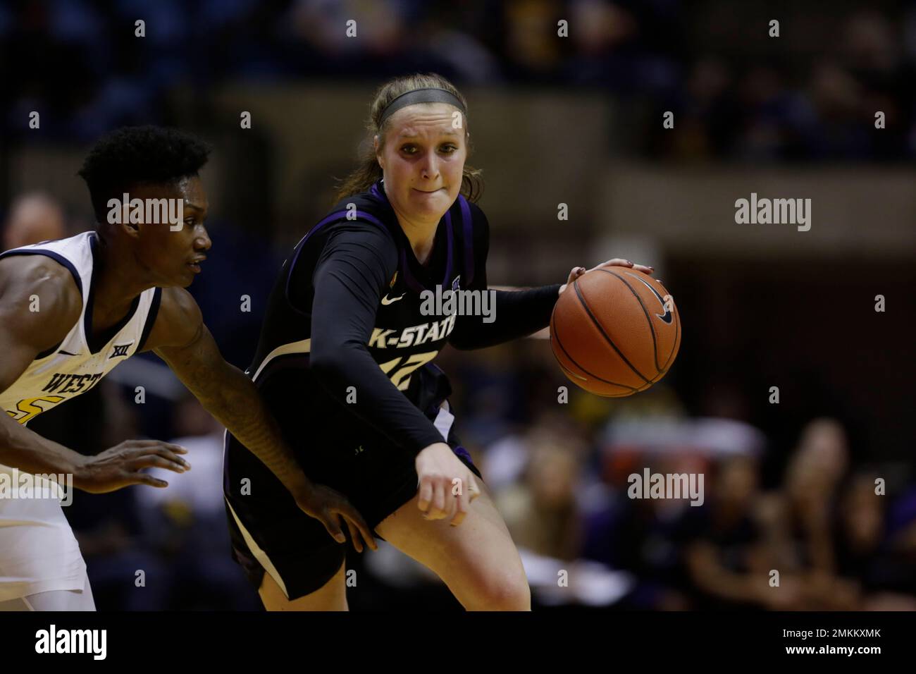 Kansas State guard Rachel Ranke (12) drives up court during the first ...