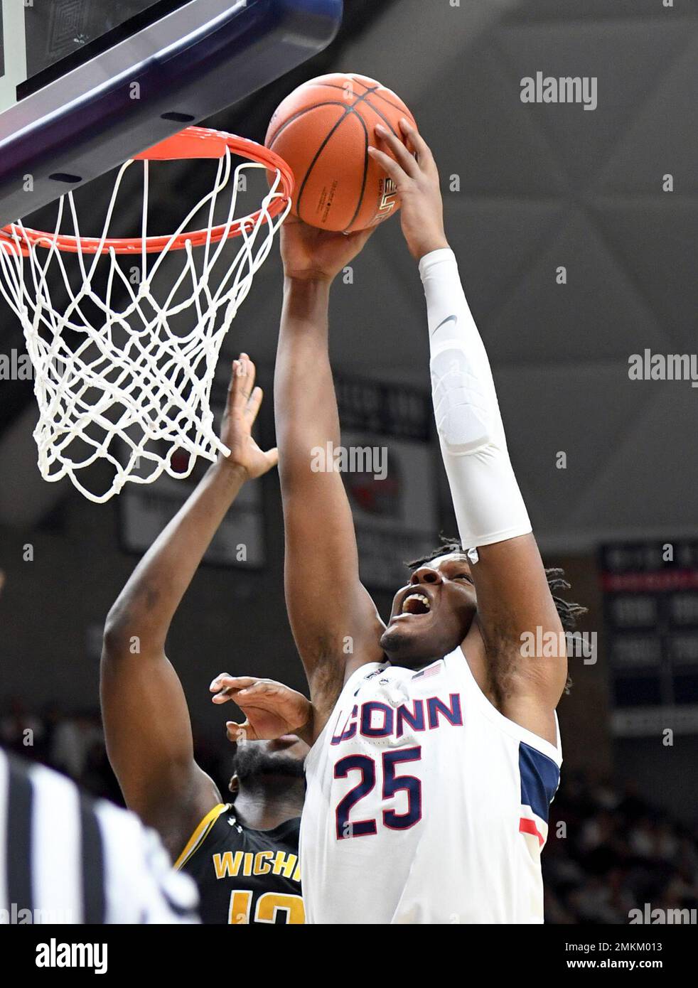 Connecticut's Josh Carlton (25) goes up for a dunk during the first ...