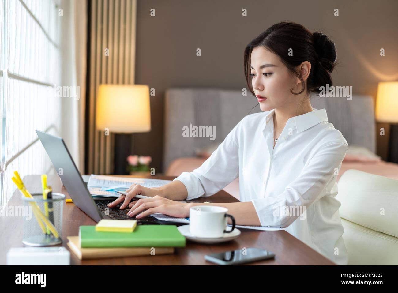 Business woman use the computer at the hotel Stock Photo - Alamy