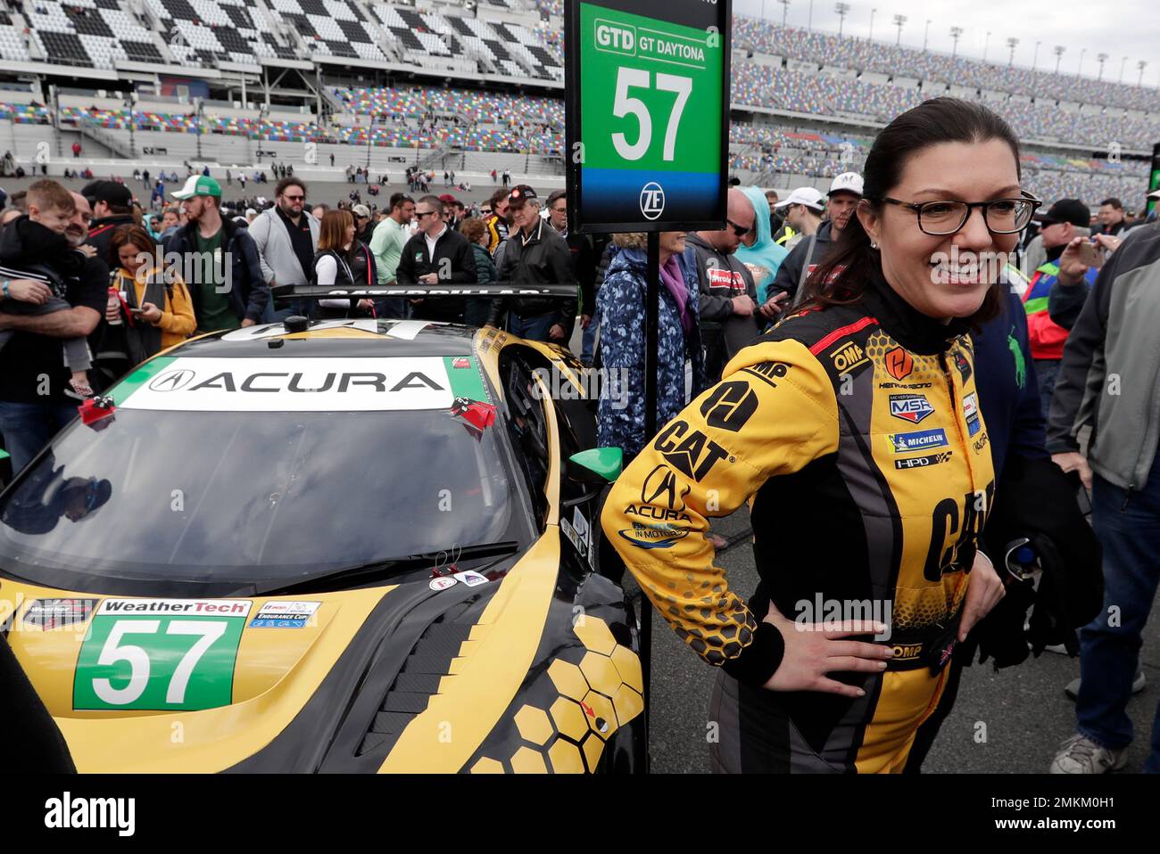 Katherine Legge, of Great Britain, stands by her Acura NSX GT3 before ...