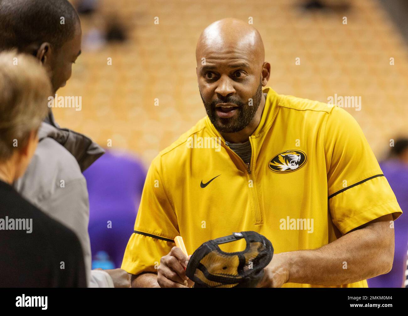 Missouri head coach Cuonzo Martin signs autographs for fans before an ...